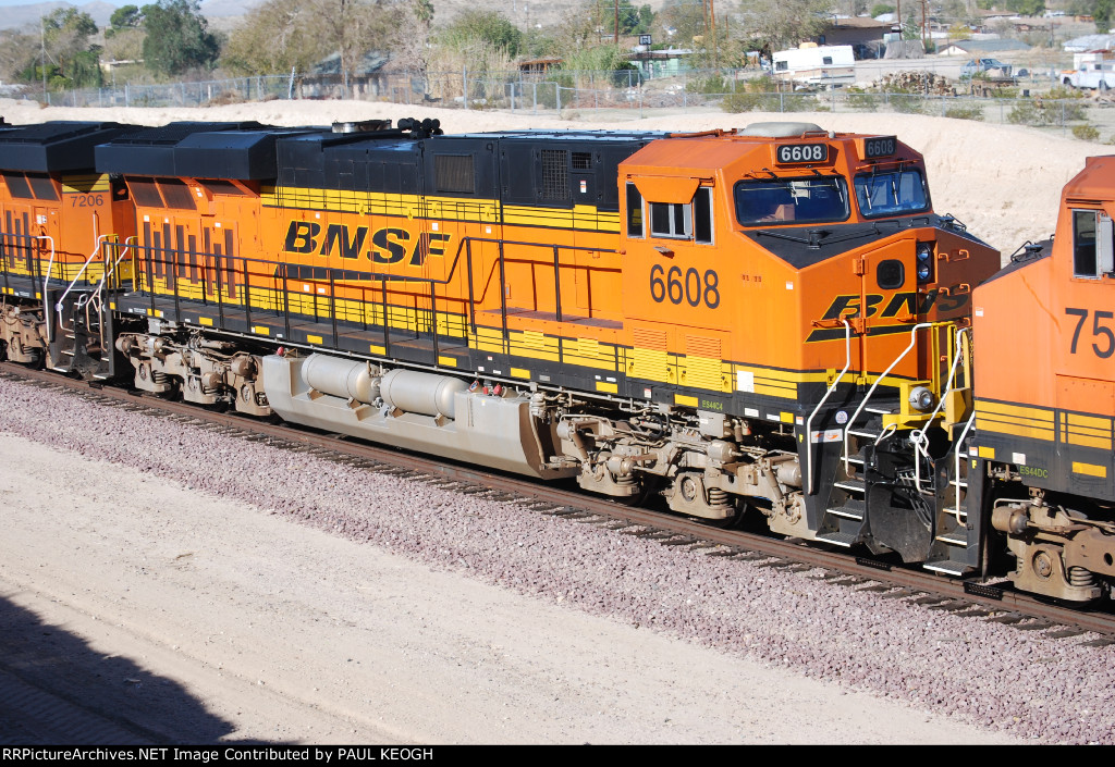 BNSF 6608 heads westbound as a # 3 unit pulling a Z-Train.